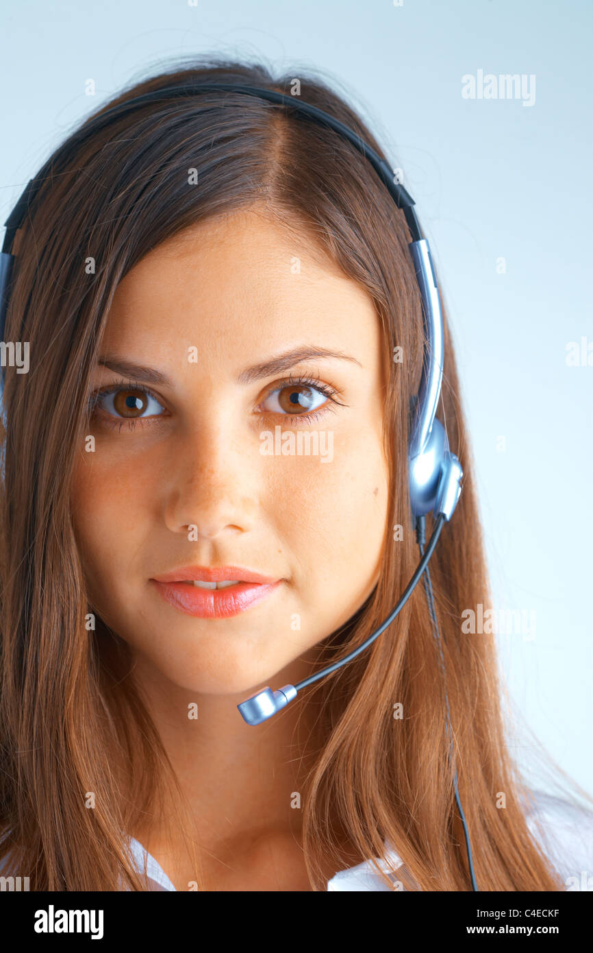 Support phone operator in headset on light blue background Stock Photo ...