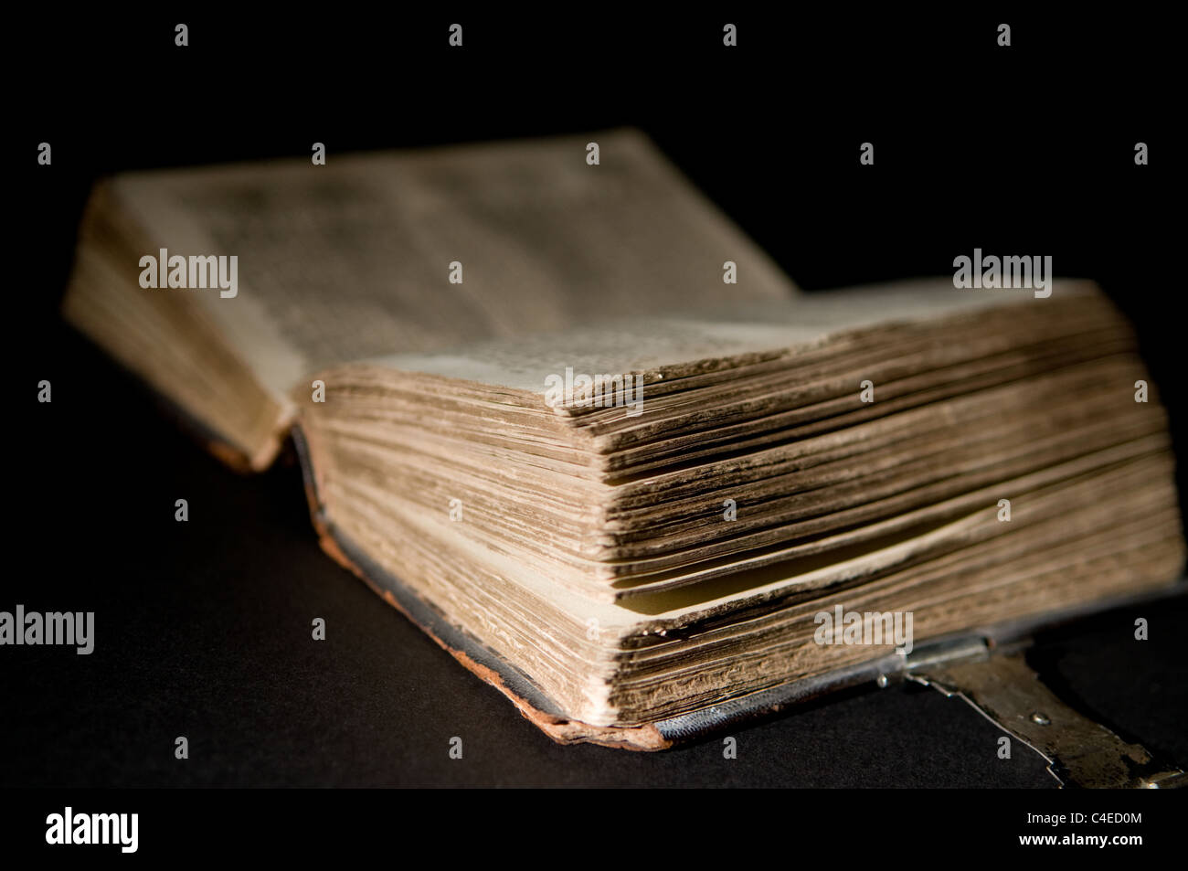 Old bible on black background Stock Photo - Alamy