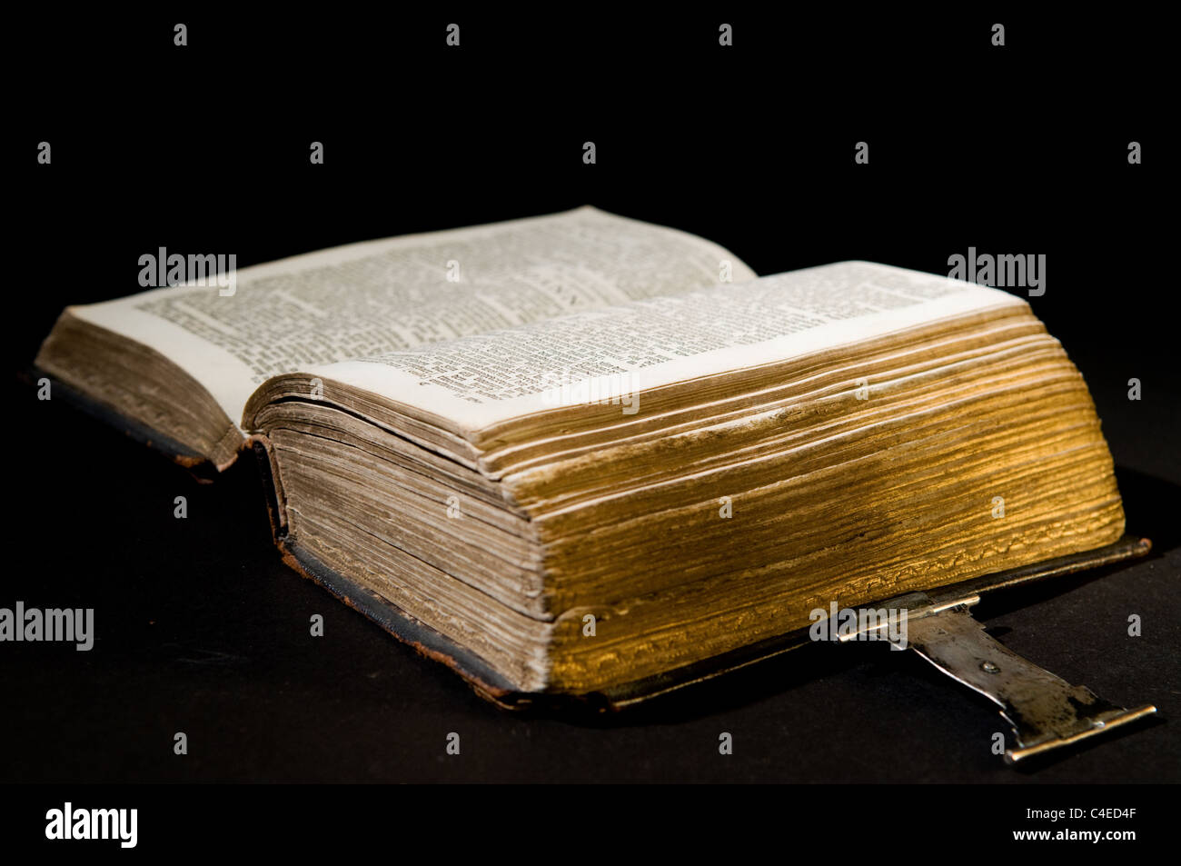 Nice old bible with an old lock on a black background Stock Photo - Alamy