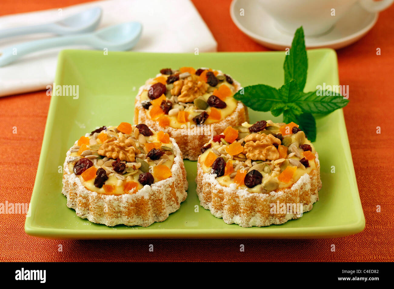 Tartlets with custard and nuts. Recipe available Stock Photo - Alamy