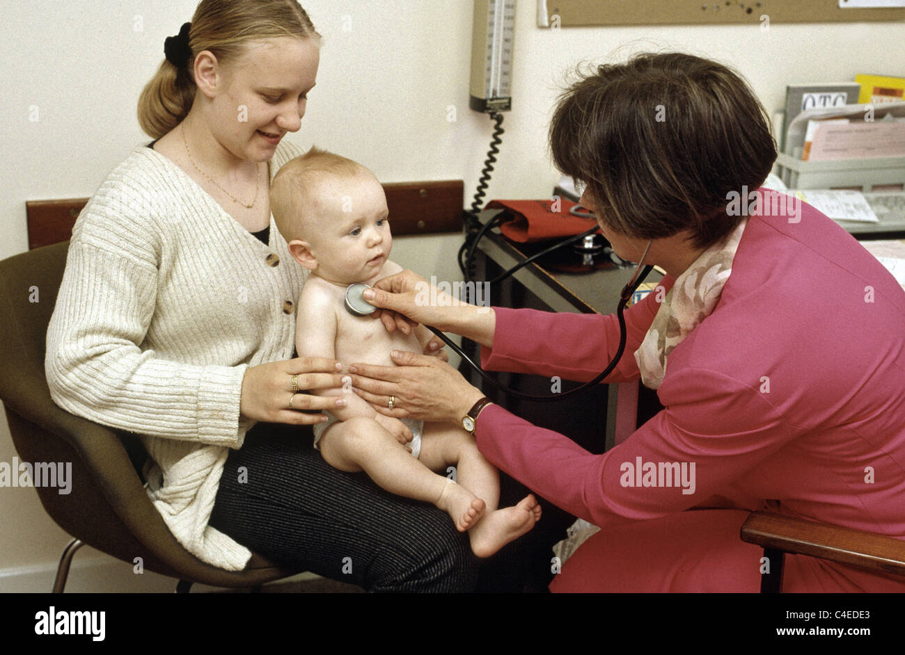 Doctor examining a baby Stock Photo - Alamy