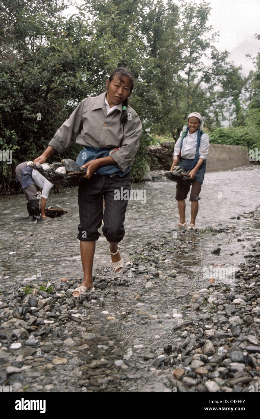 Women picking up marble from stream in Dali Yunnan province Stock Photo ...