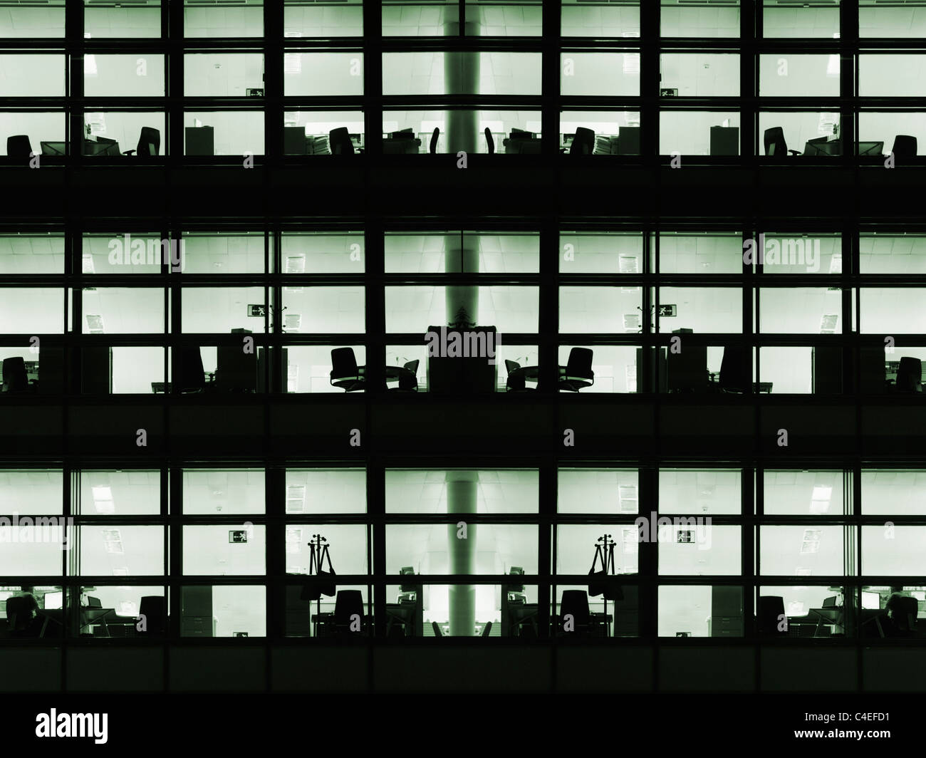 Empty offices at night with lights on Stock Photo - Alamy