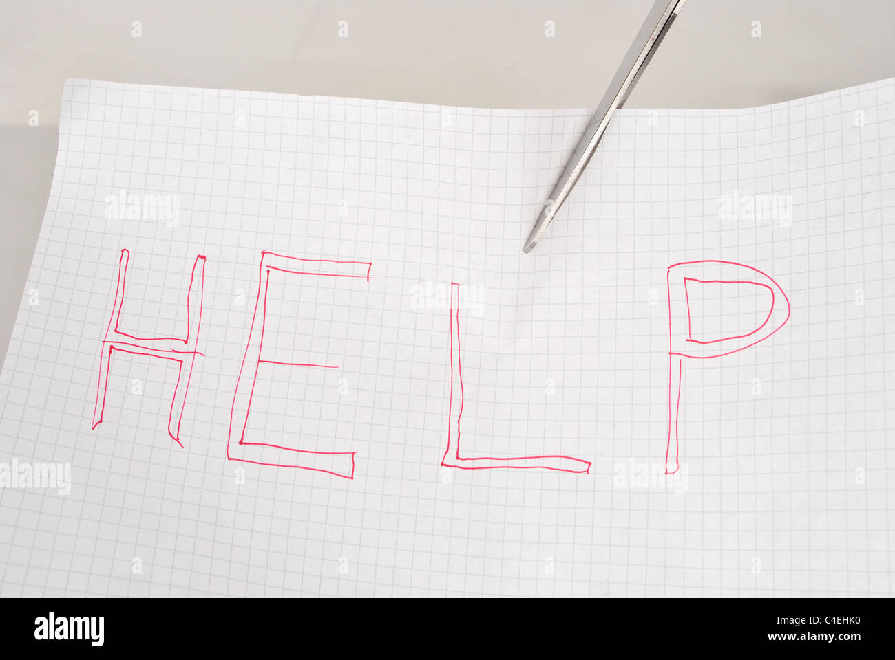 Paper notebook with handwriting help message Stock Photo - Alamy