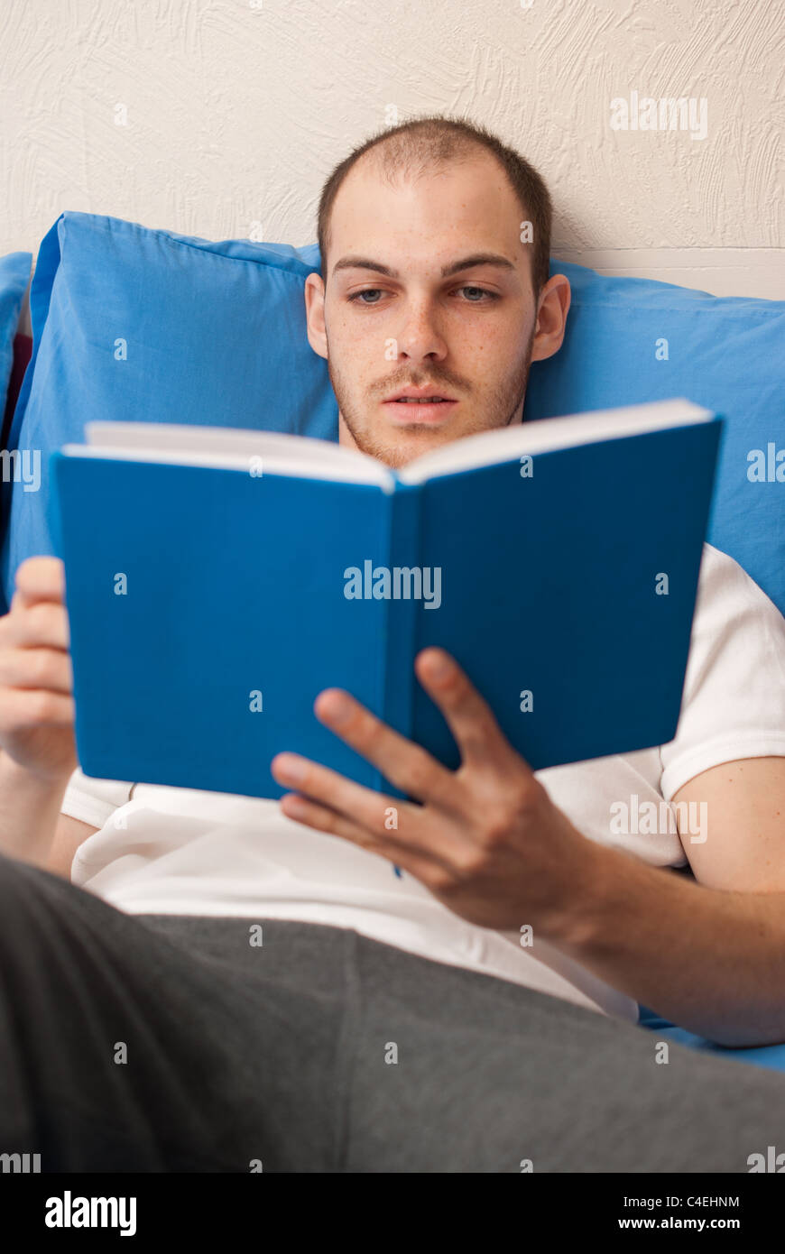 Man reading a book Stock Photo - Alamy