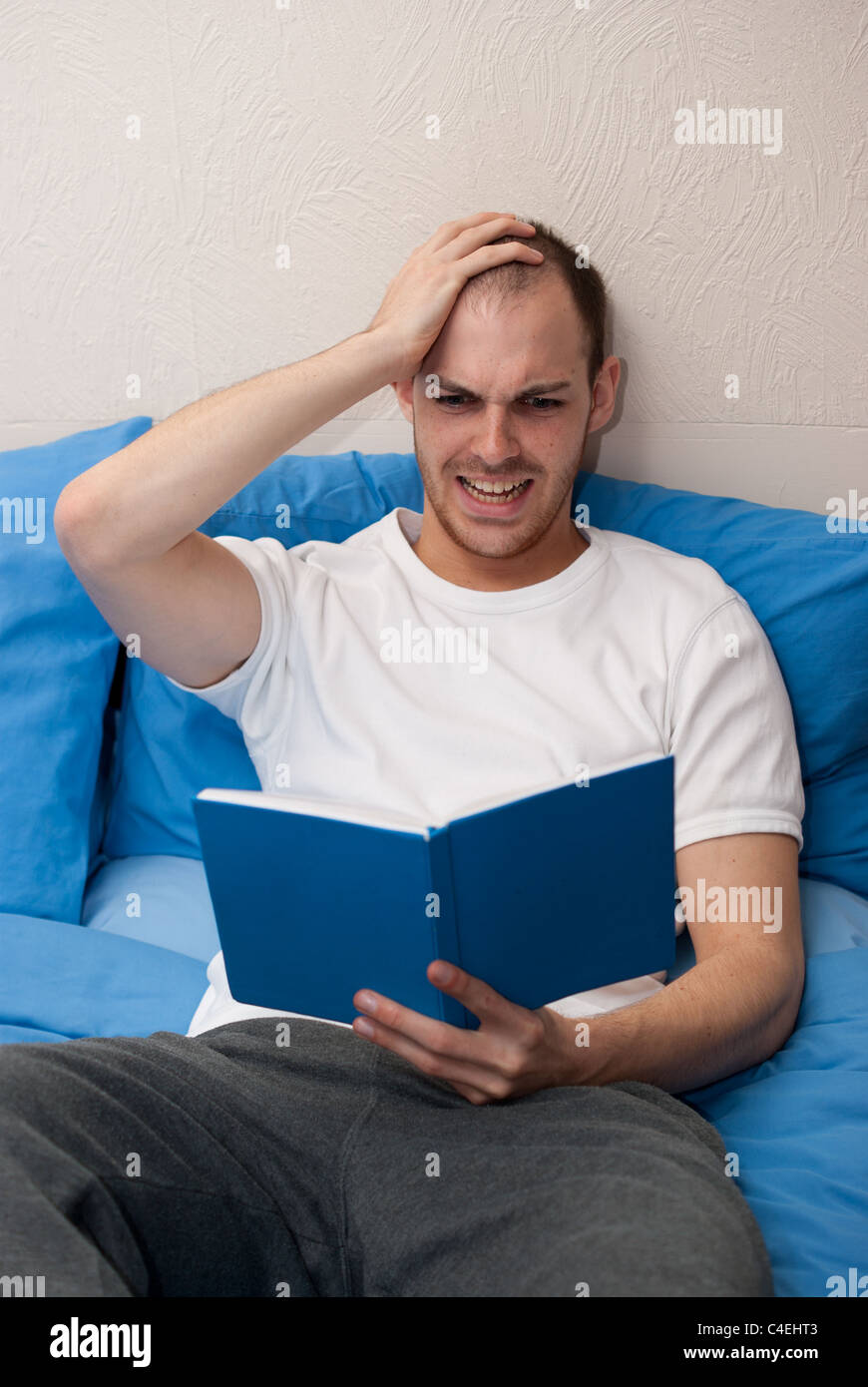 Man reading a book Stock Photo - Alamy
