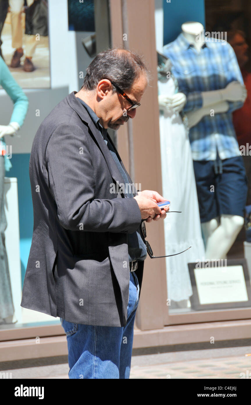 Man texting text message mobile phone Stock Photo - Alamy