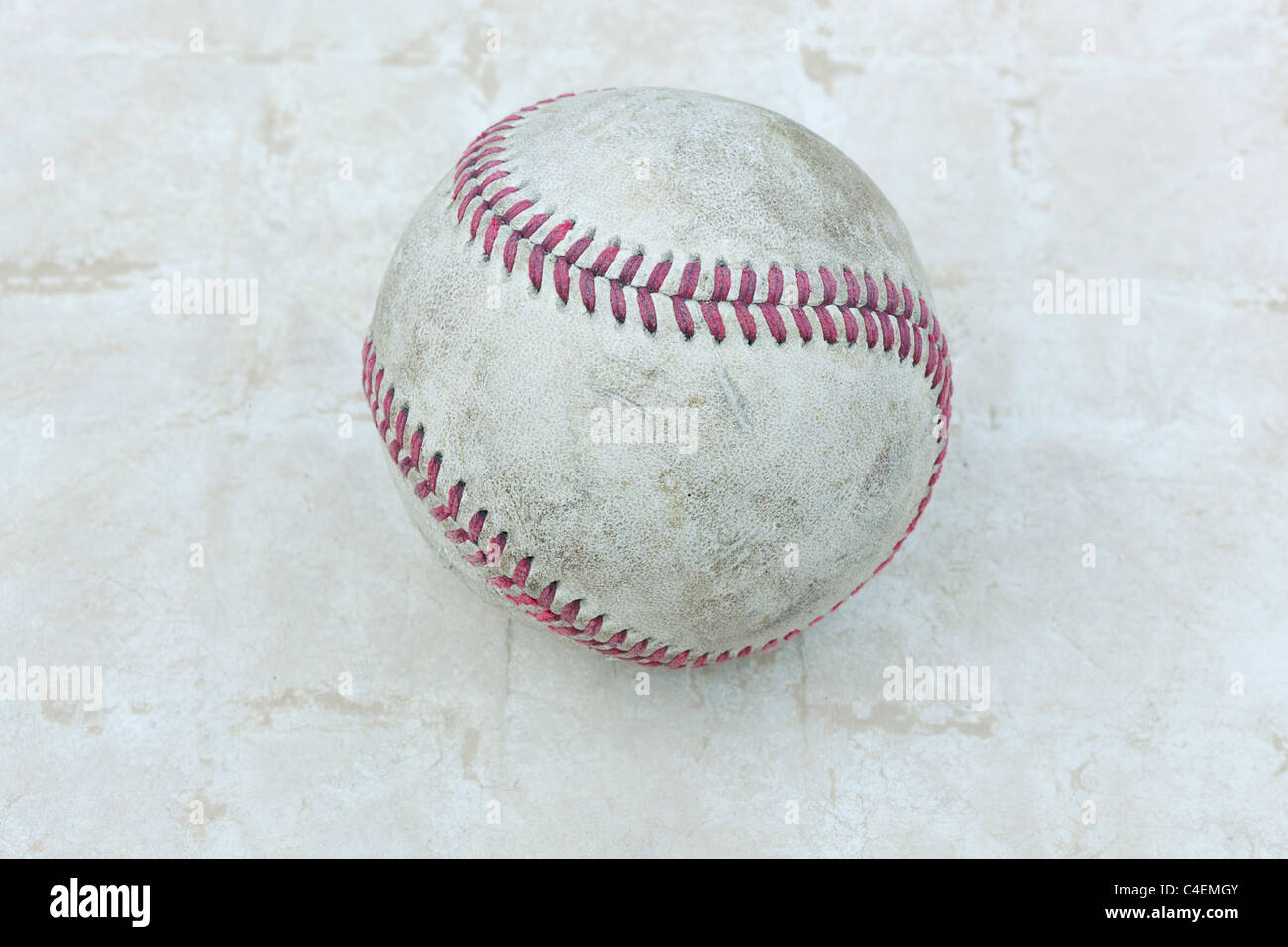 An old worn baseball on a baseball field Stock Photo - Alamy