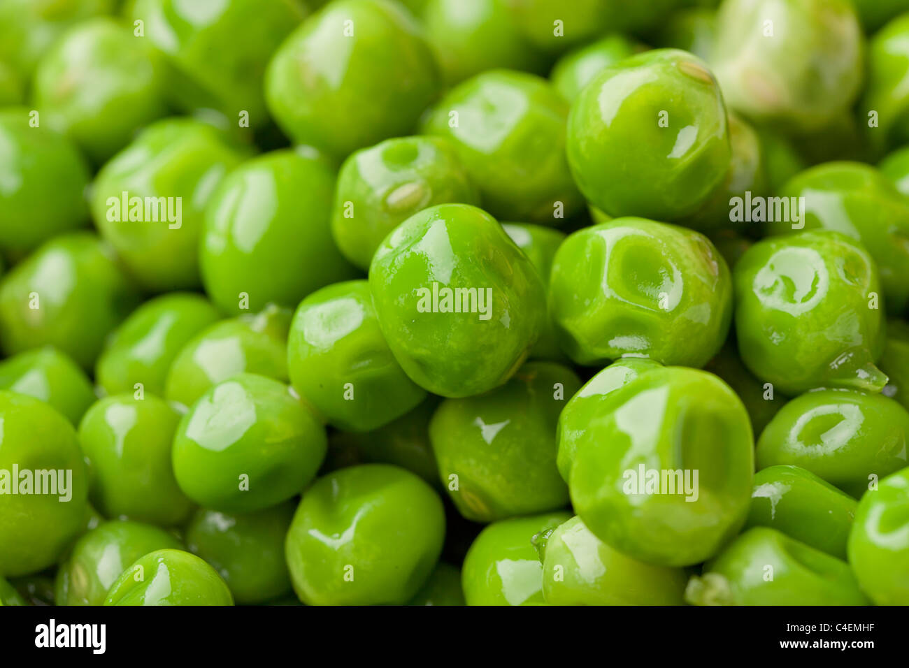Fresh green peas being washed with water Stock Photo - Alamy
