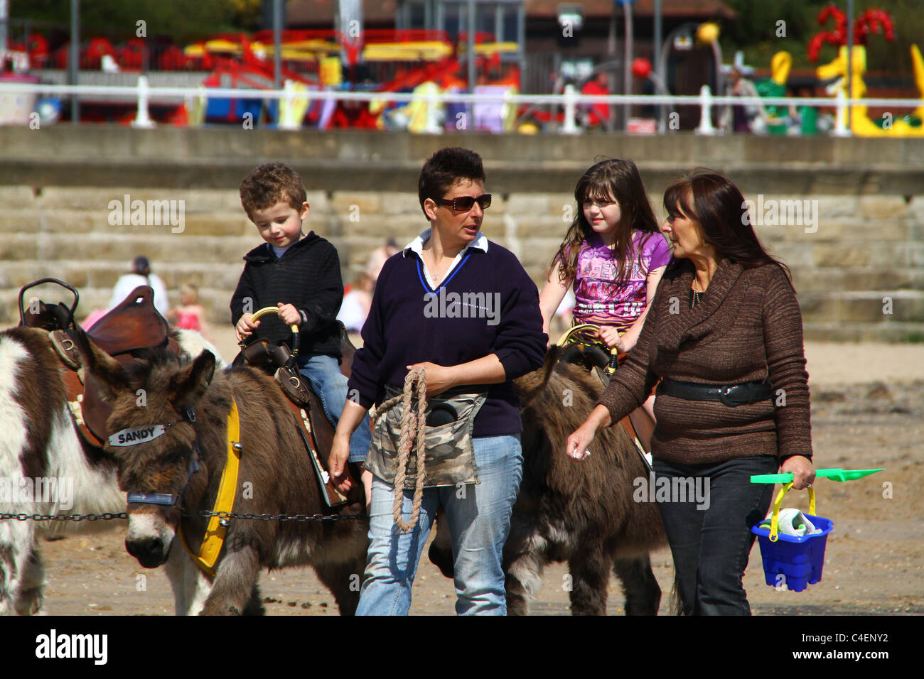 Donkey ride on beach Stock Photo - Alamy