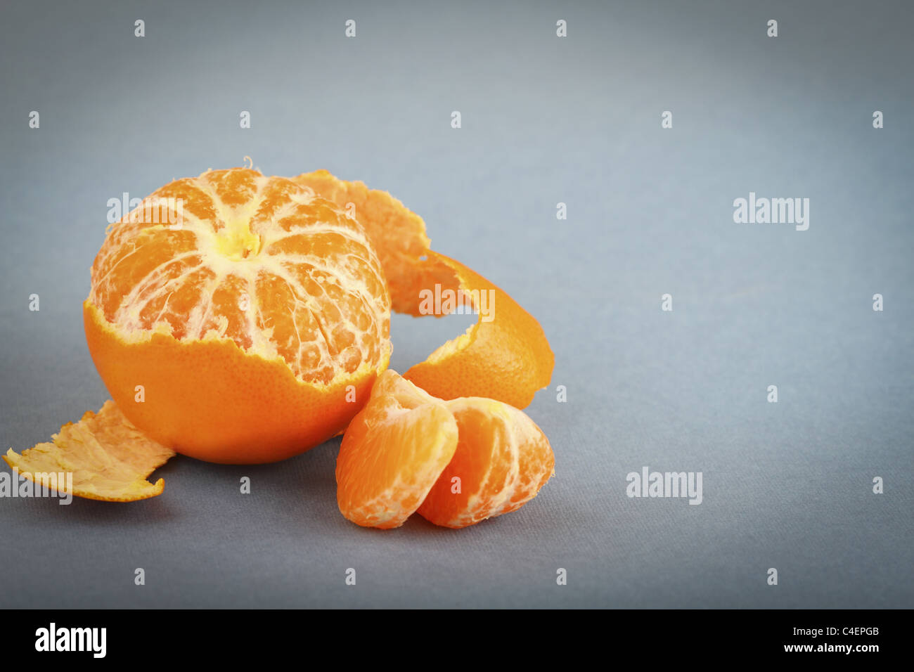 Tangerine with peeled skin Stock Photo - Alamy