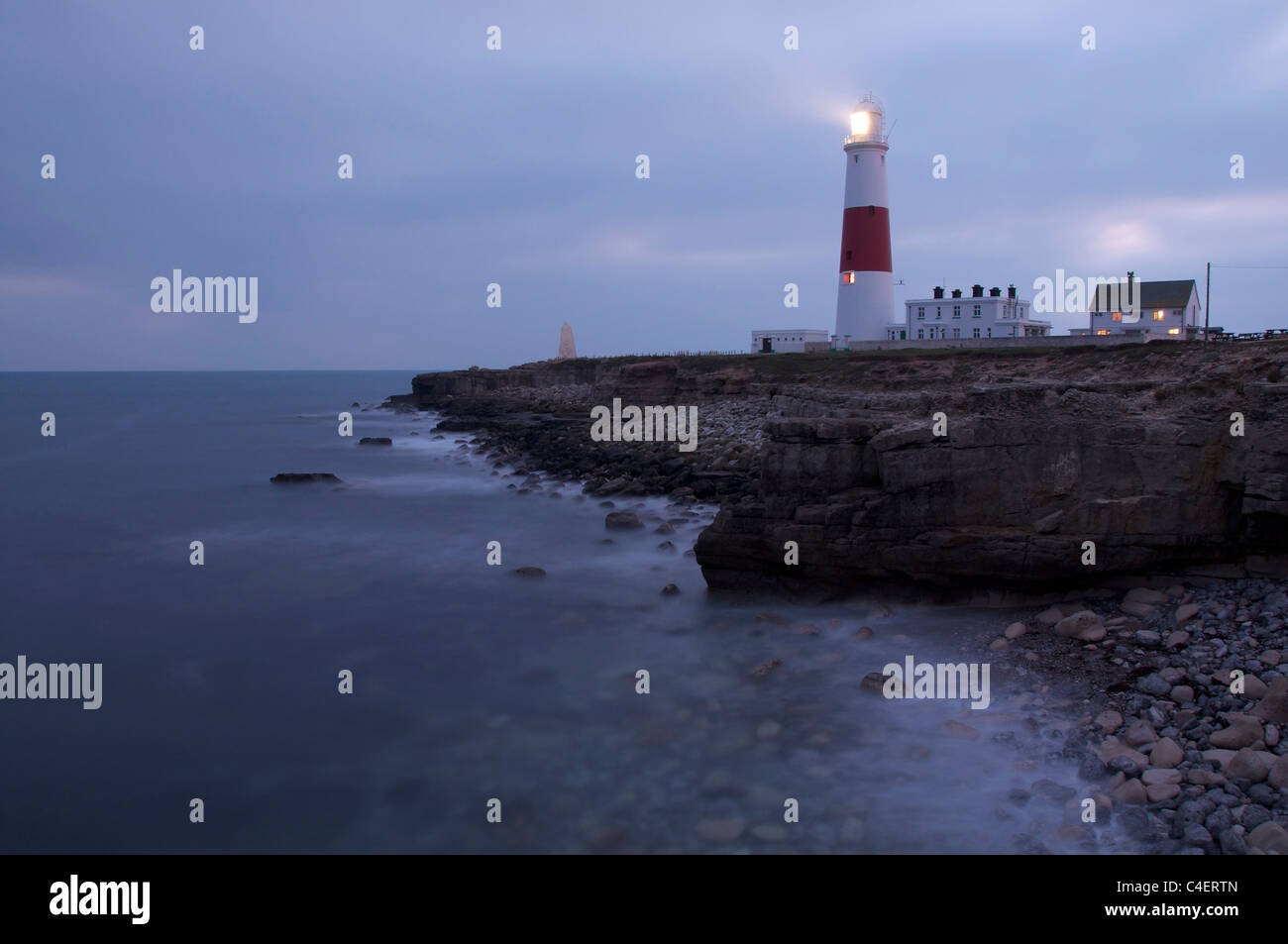 The Trinity House Lighthouse at Portland Bill shines it's light out to ...