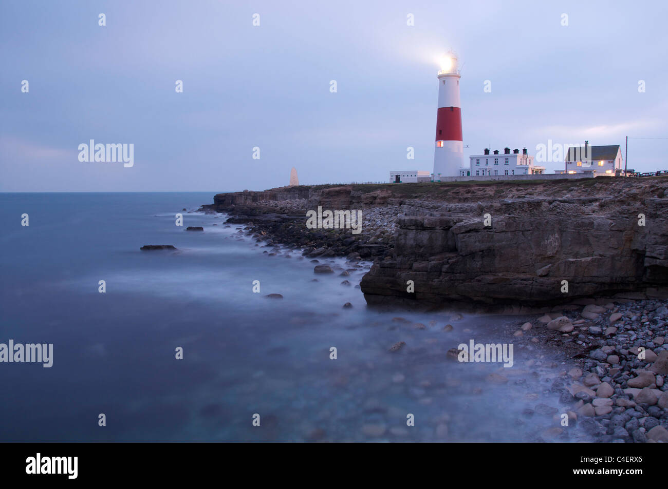The Trinity House Lighthouse at Portland Bill shines it's light out to ...