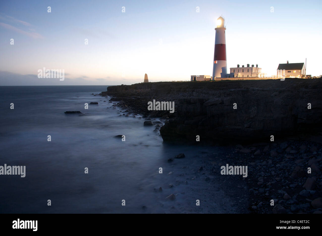 The Trinity House Lighthouse at Portland Bill shines it's light out to ...