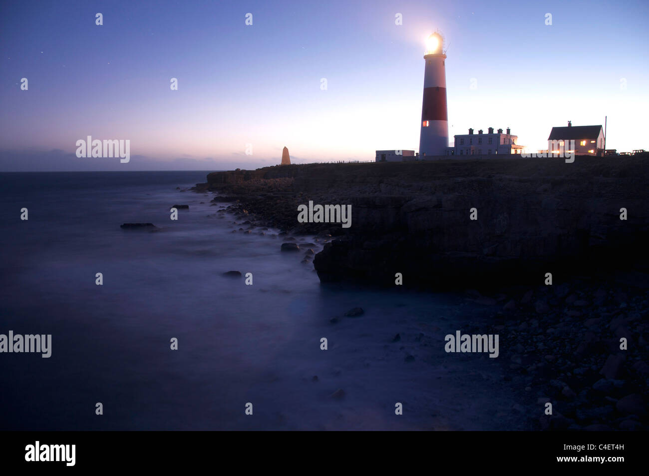 The Trinity House Lighthouse at Portland Bill shines it's light out to ...
