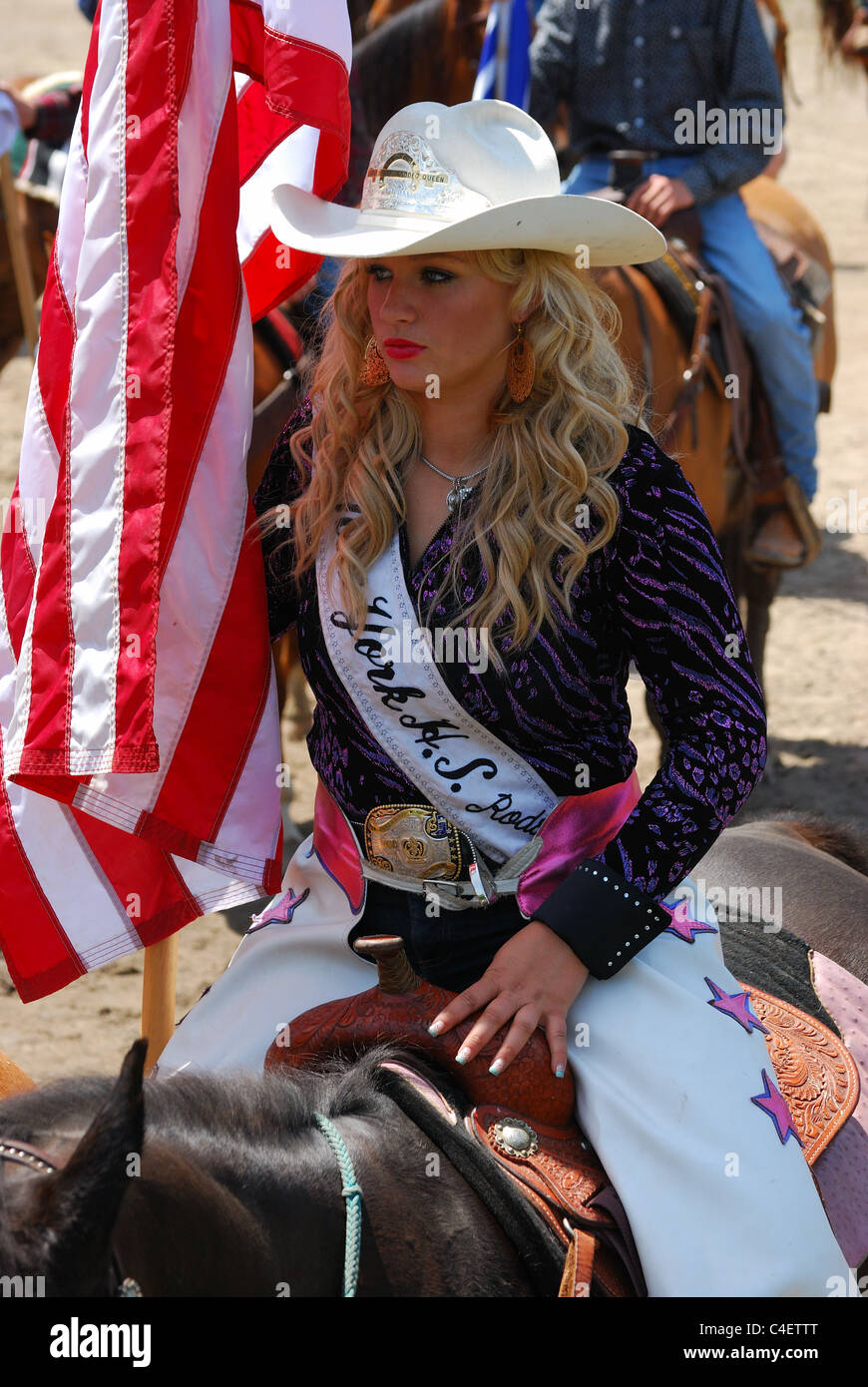 Teenage girl with white western cowgirl hat and US flag Stock Photo - Alamy