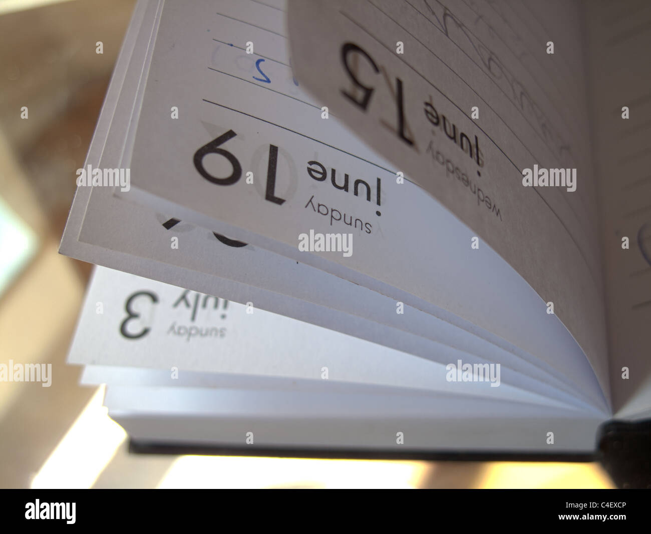 Pages of a diary flicking over Stock Photo - Alamy