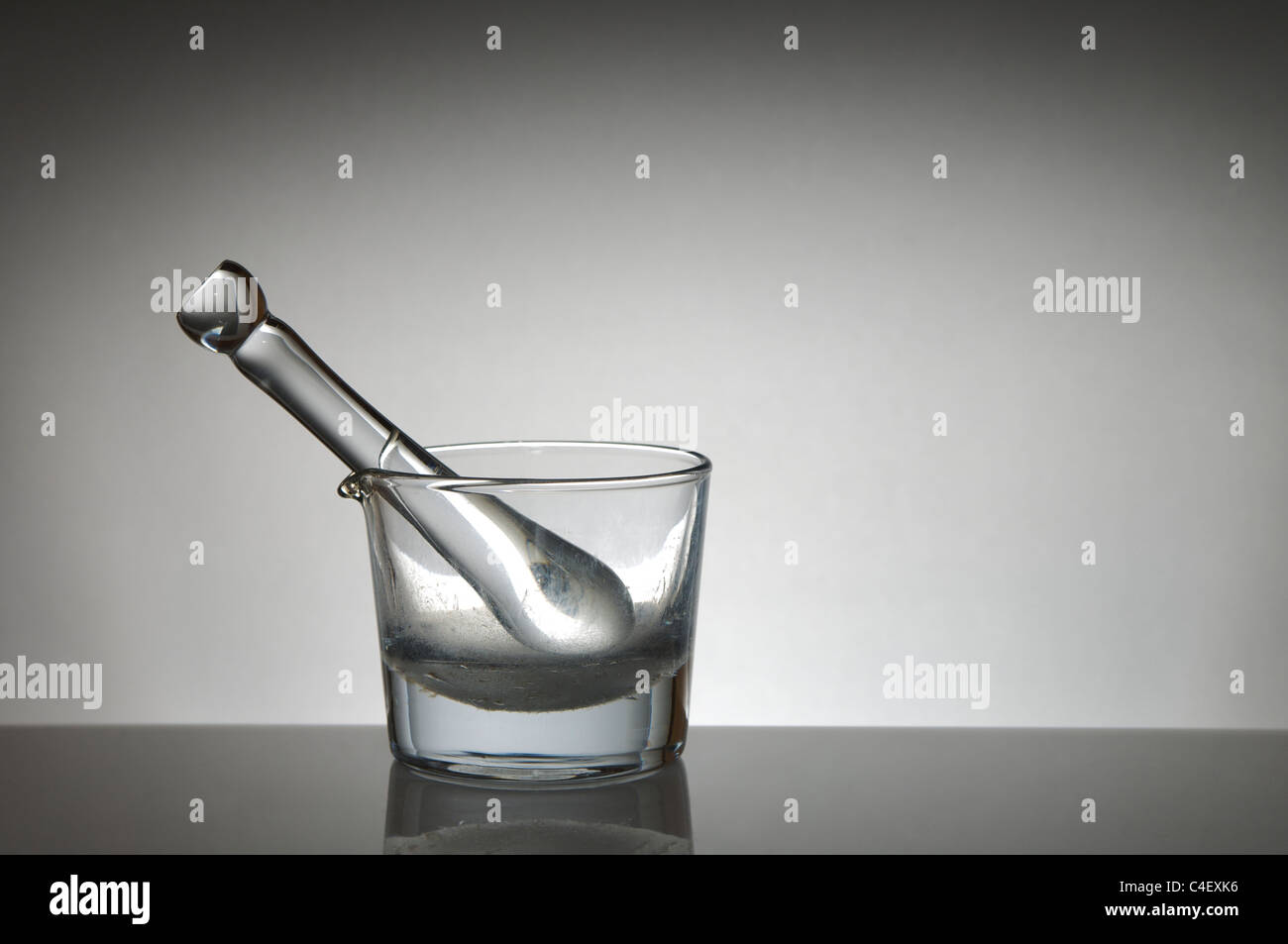 Laboratory mortar with a white background Stock Photo - Alamy