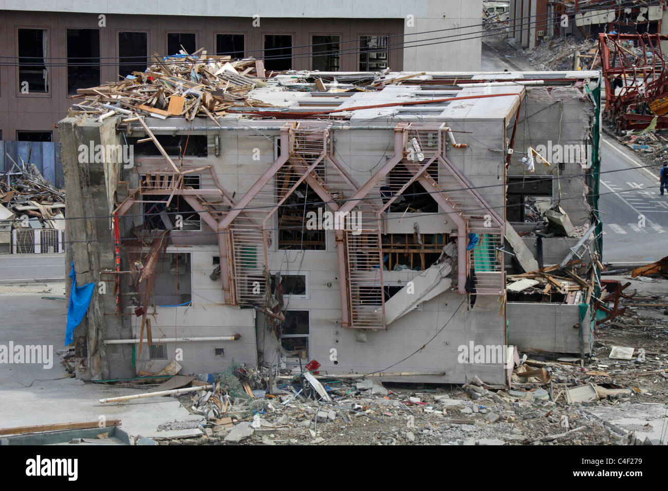 A building knocked over tsunami at Onagawa Miyagi Japan Stock Photo - Alamy