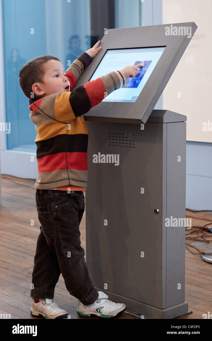 The grandson of Dr John Taylor OBE, 74, plays with an interactive ...