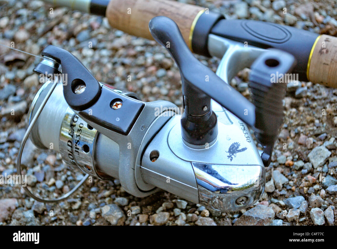 Close up of a reel of a fishing rod Stock Photo - Alamy
