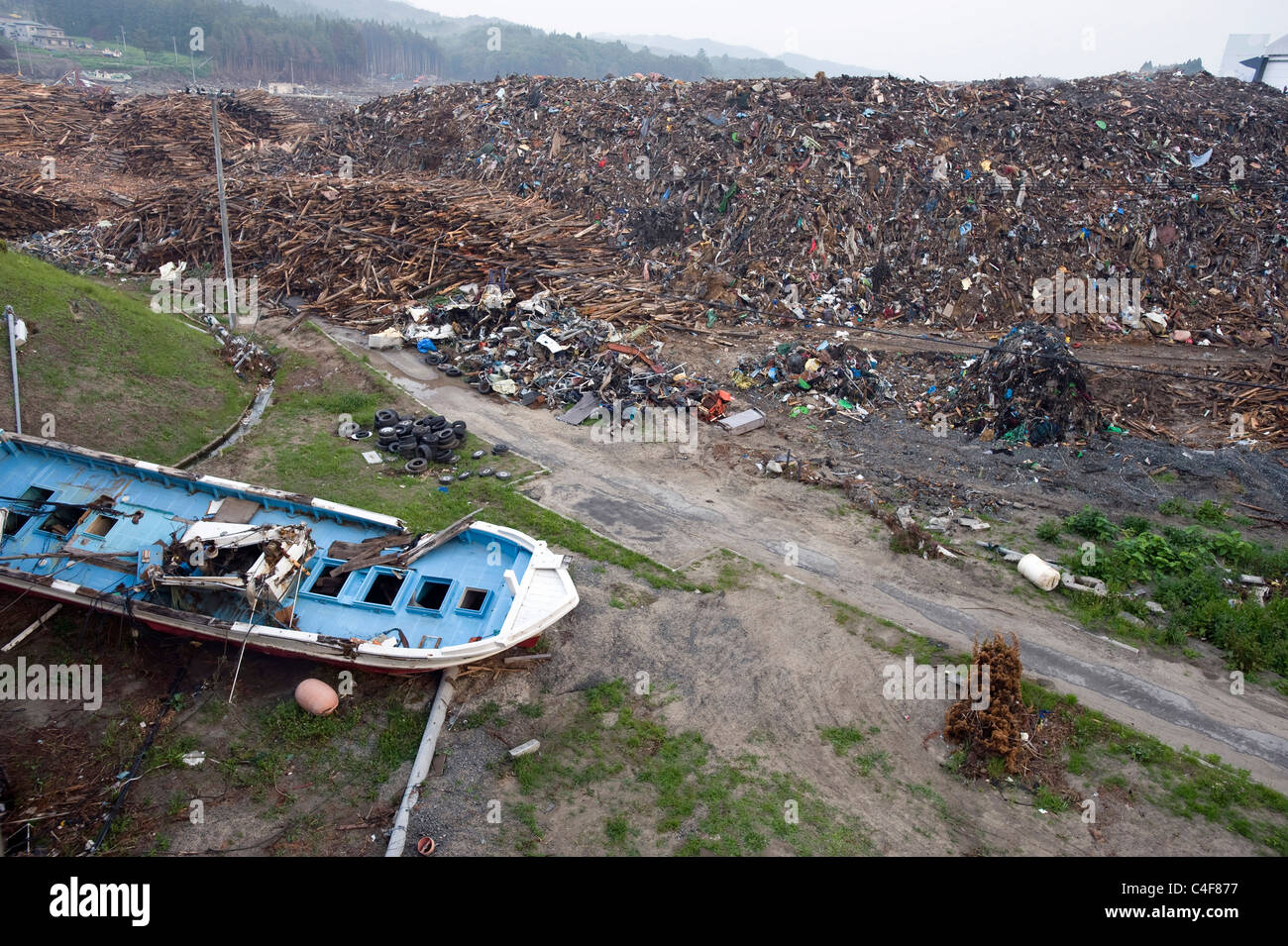 Photo shows a waste collection site where debris from the March 11 ...
