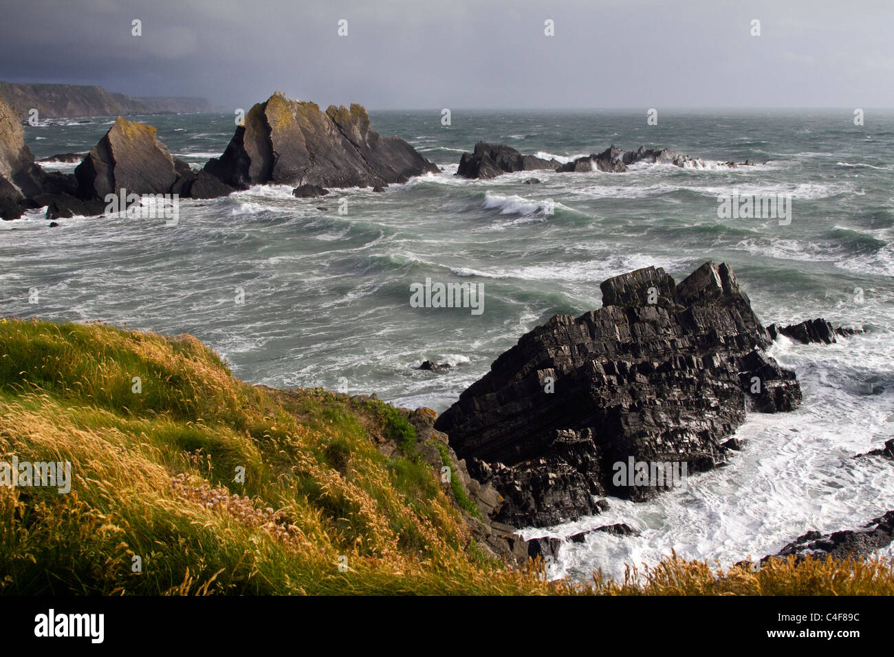 Rough seas at the coast; The town's harbour, bay Hartland Quay South ...