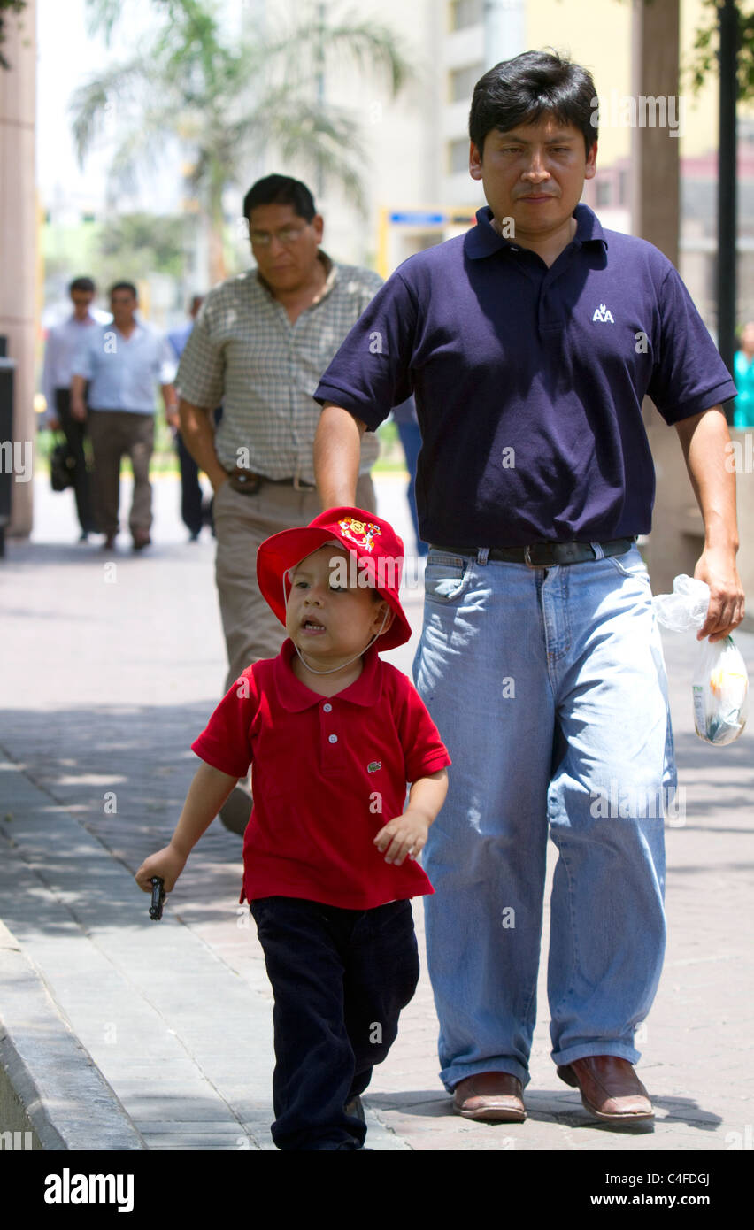 Father and son in Central Park of the Miraflores district of Lima, Peru ...