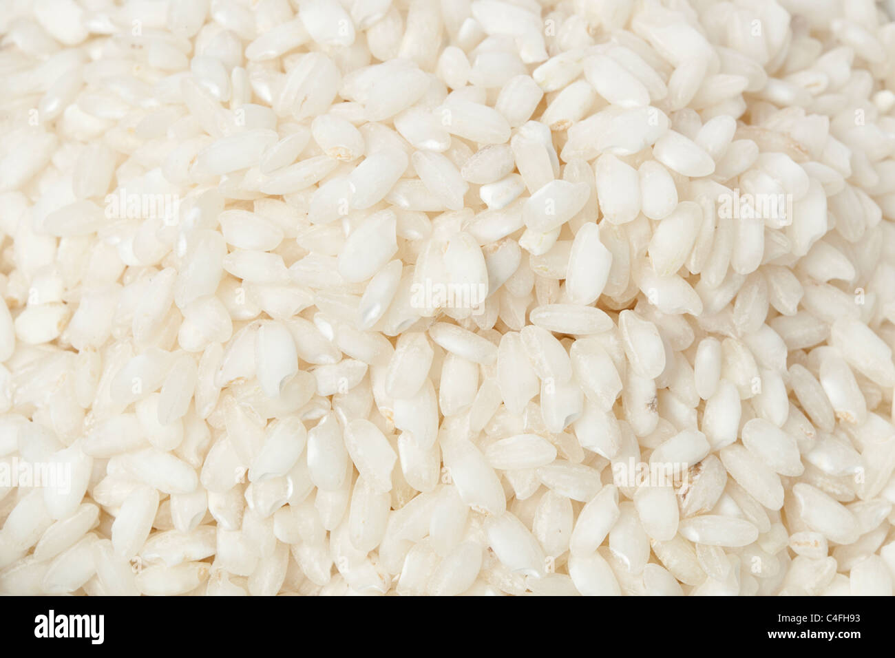 Dry White Rice against a white background Stock Photo - Alamy