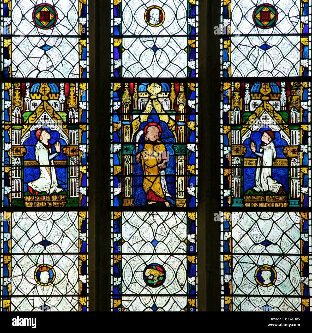 13th and 14th Century stained glass windows, Saint with kneeling ...