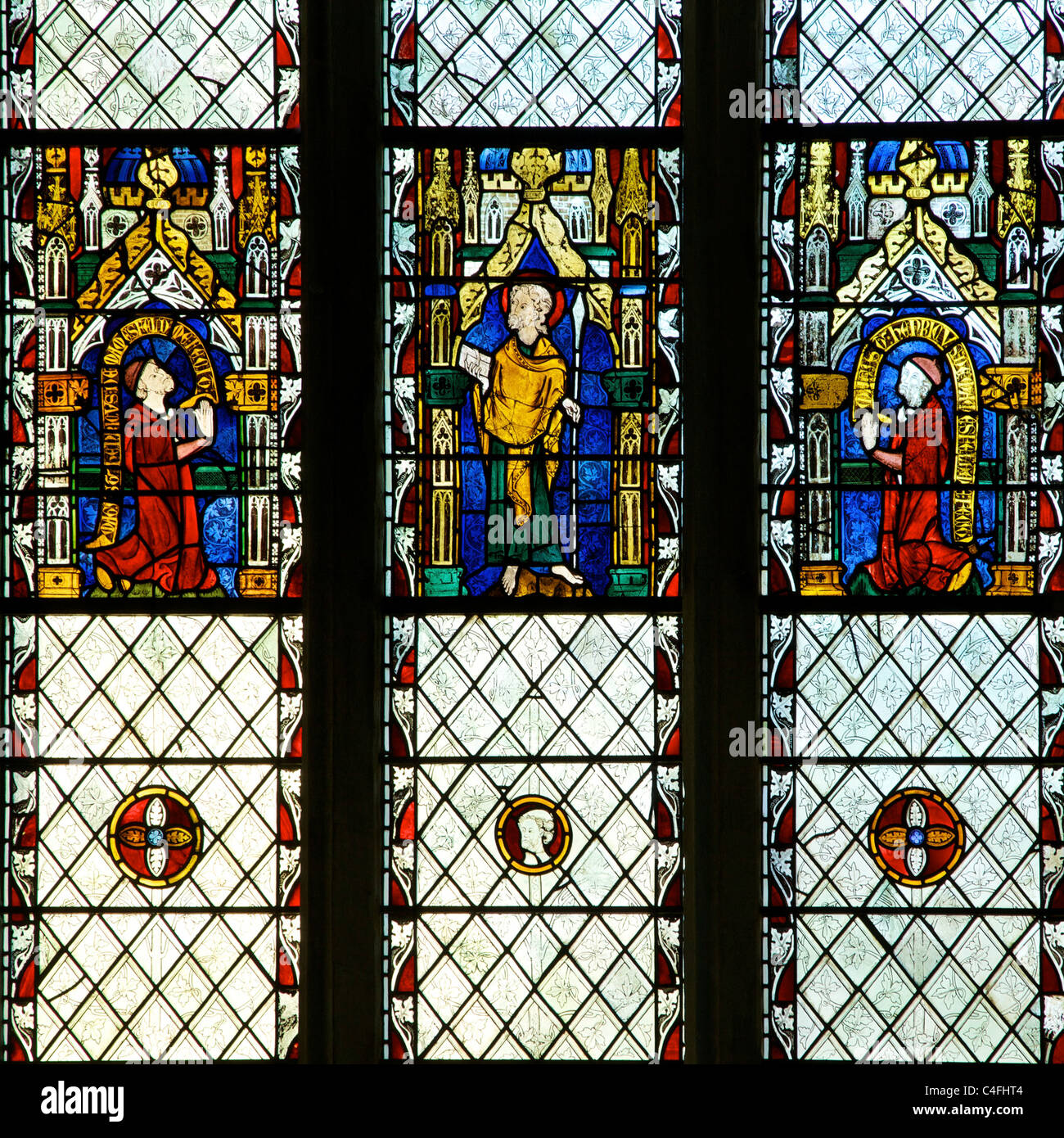 13th and 14th Century stained glass windows, Saint with kneeling ...