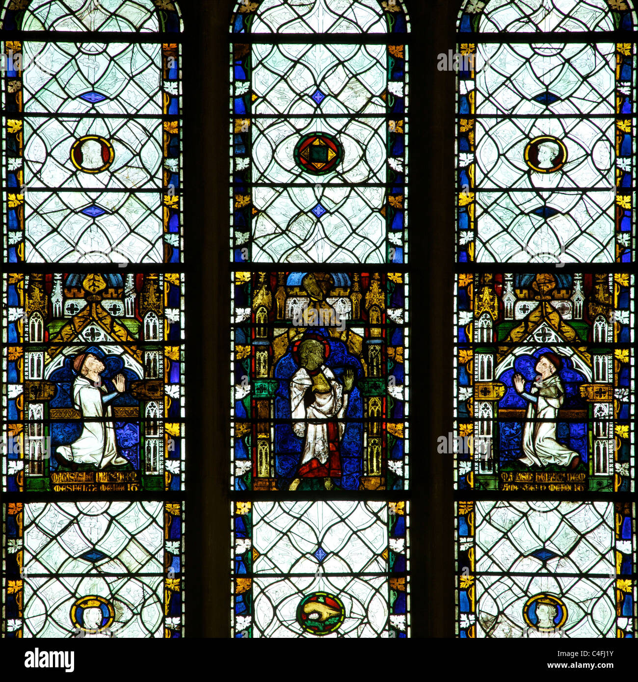 13th and 14th Century stained glass windows, Saint with kneeling ...