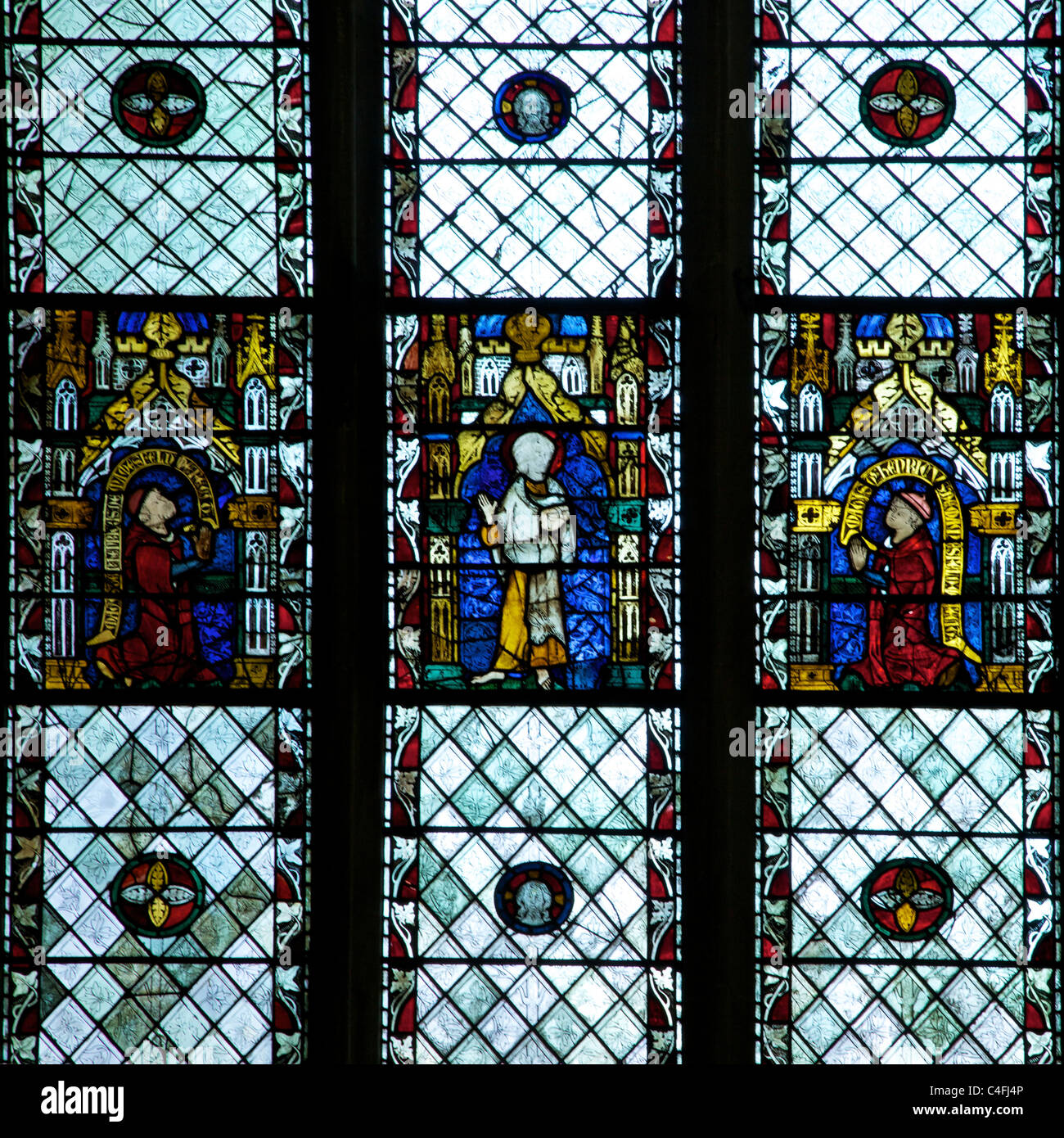 13th and 14th Century stained glass windows, Saint with kneeling ...