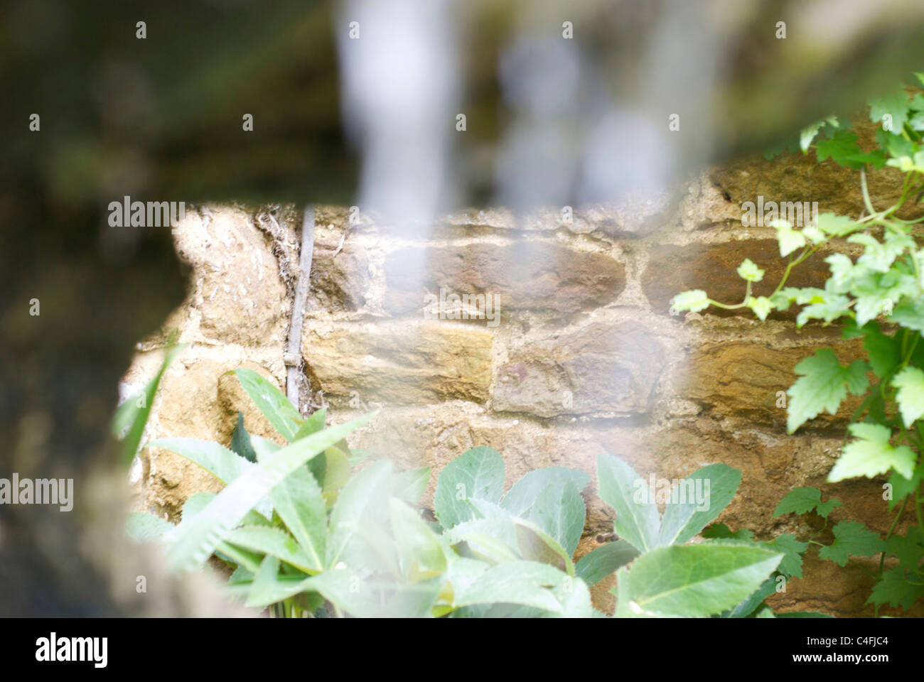 Wall through water Stock Photo - Alamy