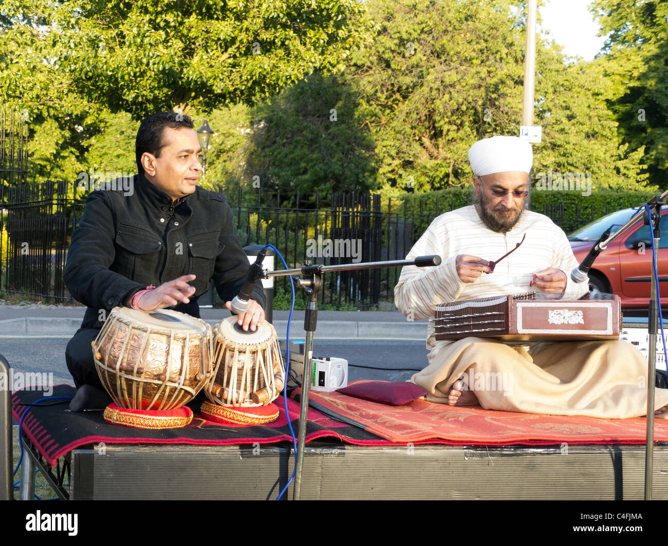 Sandeep Rawal playing tabla and Kiranpal Singh playing a Kashmiri ...