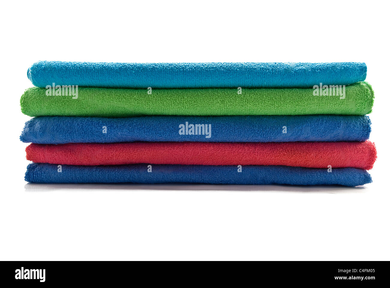 stack of colorful towels on a white background Stock Photo - Alamy