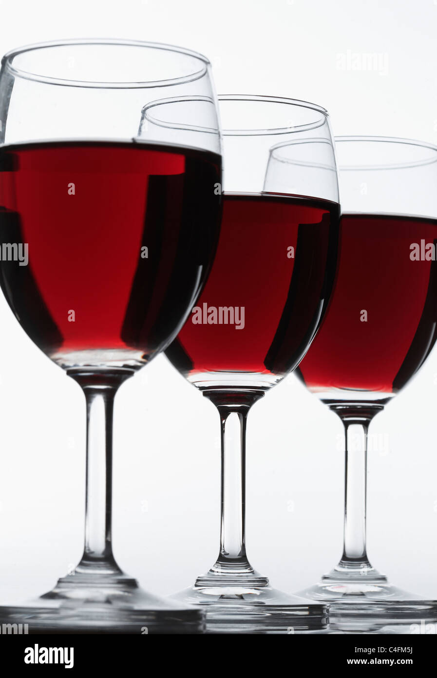 Three glasses of red wine. Focus is on the first glass Stock Photo - Alamy