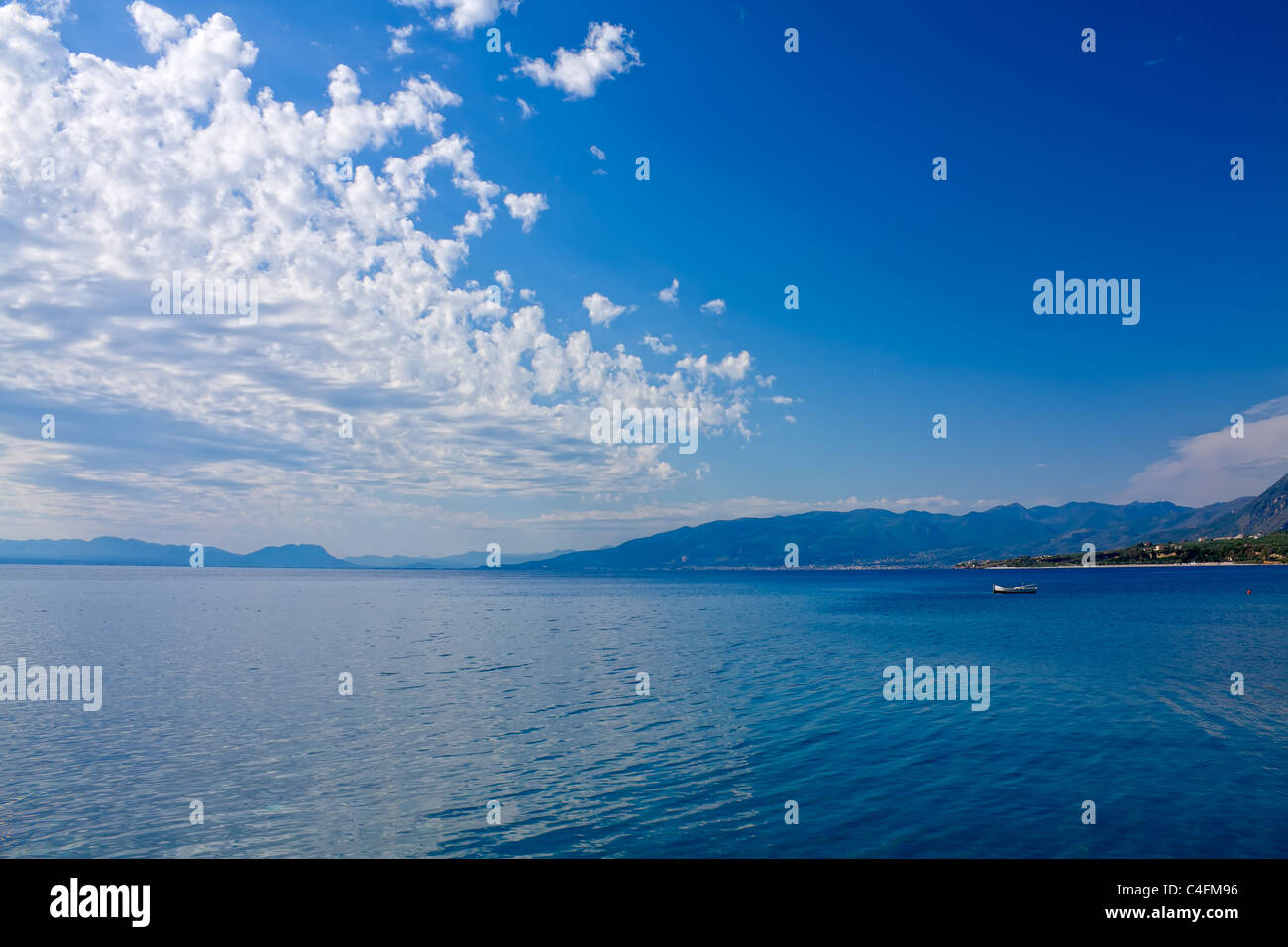 Typical Greek sea landscape against blue sky and clouds Stock Photo - Alamy