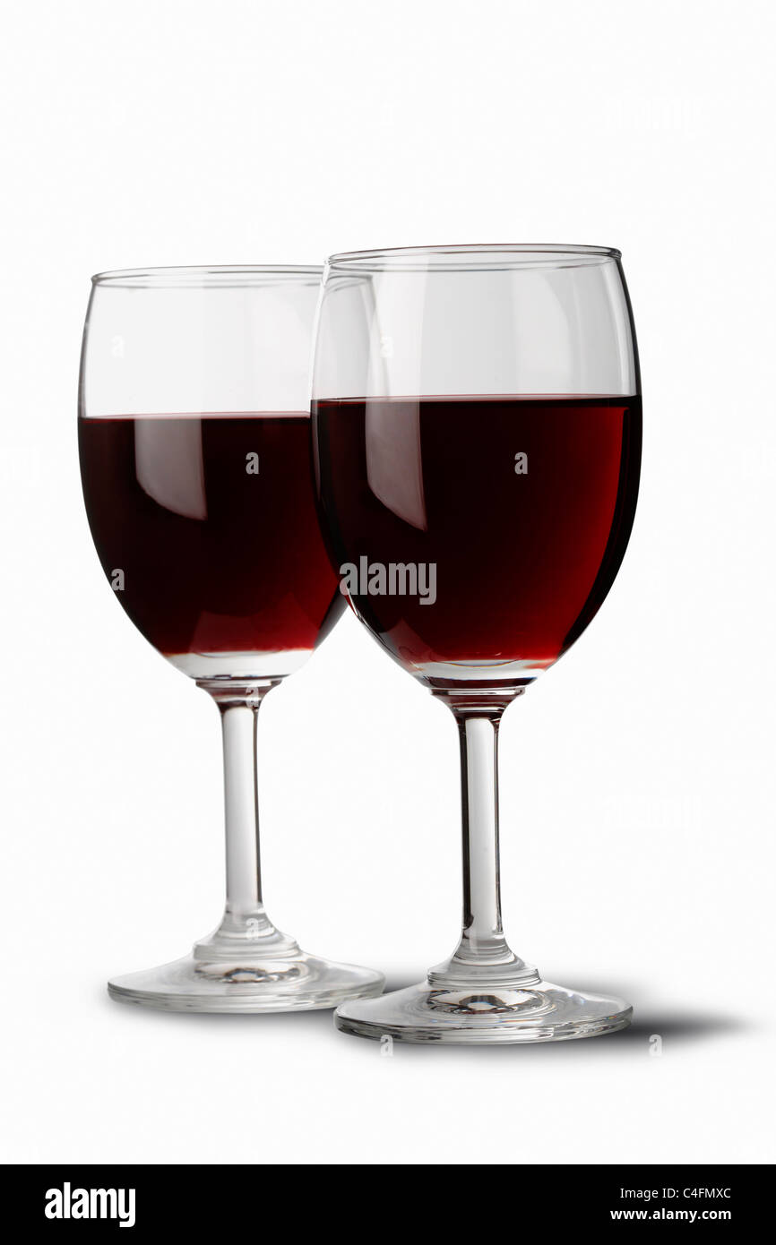 Red wine on white background. Focus is on the first glass Stock Photo ...
