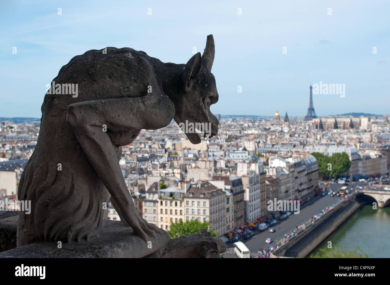 Famous Chimera (demon shape) overlooking the Eiffel Tower from Notre ...