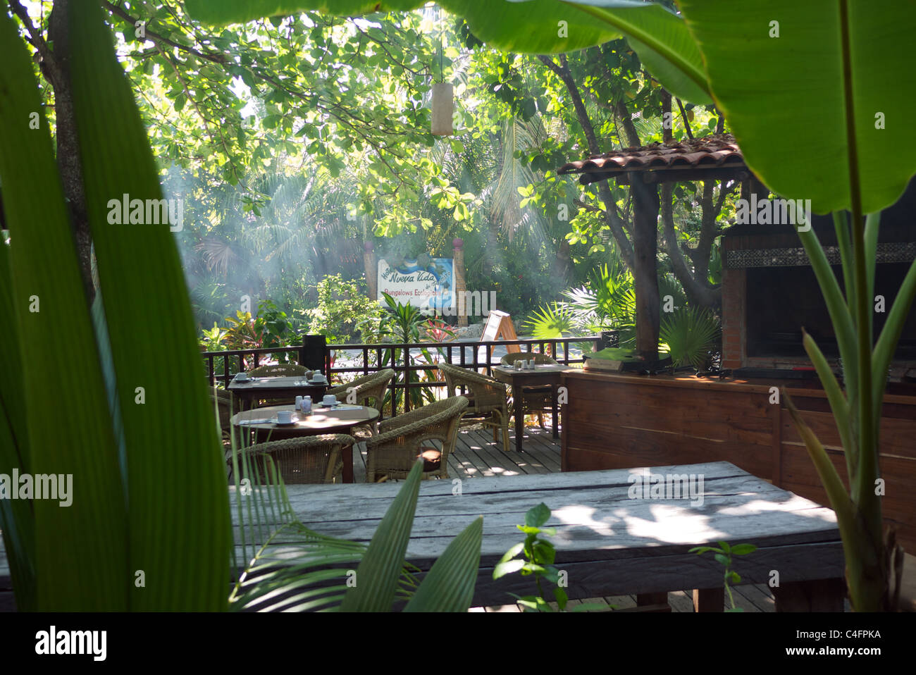 Outdoor restaurant in jungle setting Stock Photo - Alamy
