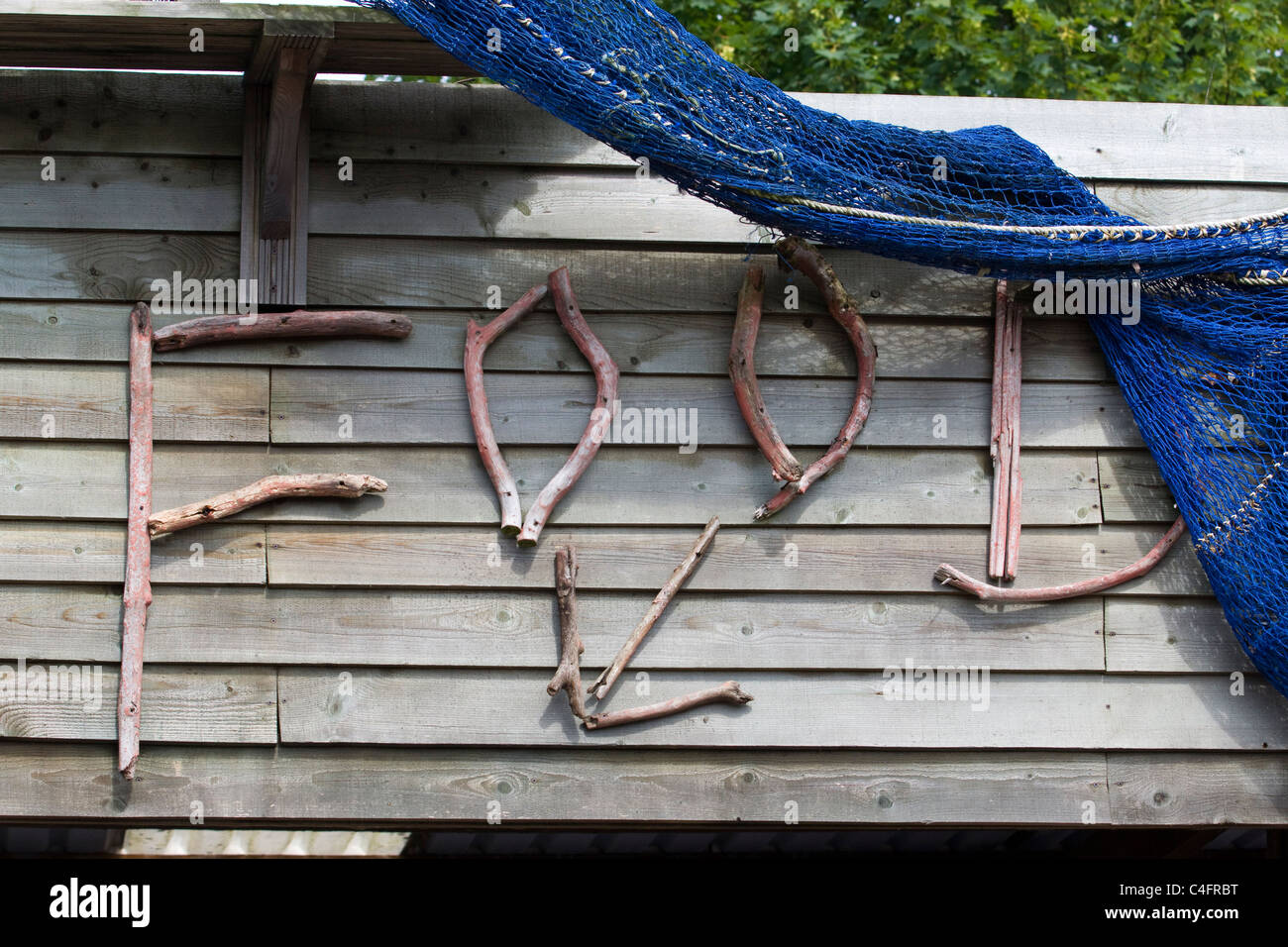 A sign Made of Wood Pointing the way to Food Stock Photo - Alamy