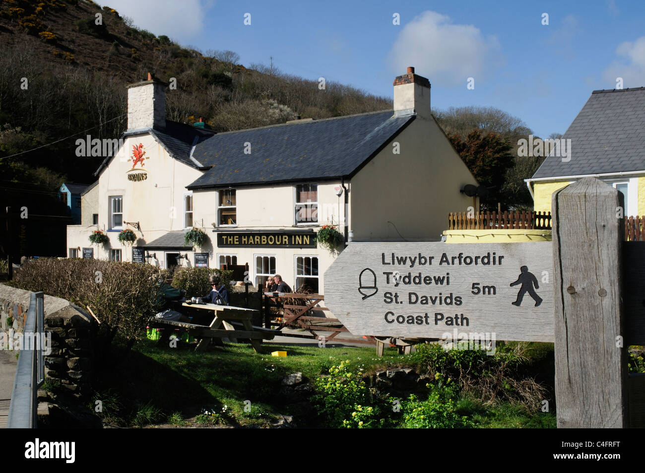 A sign and a pub at Solva on the Pembrokeshire National Park coast path ...