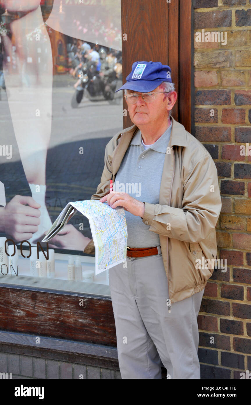 Old man tourist lost map reading London Stock Photo - Alamy