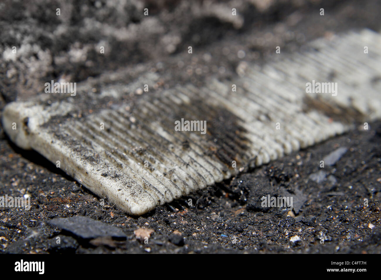 dirty white male comb covered in coal dust Stock Photo - Alamy