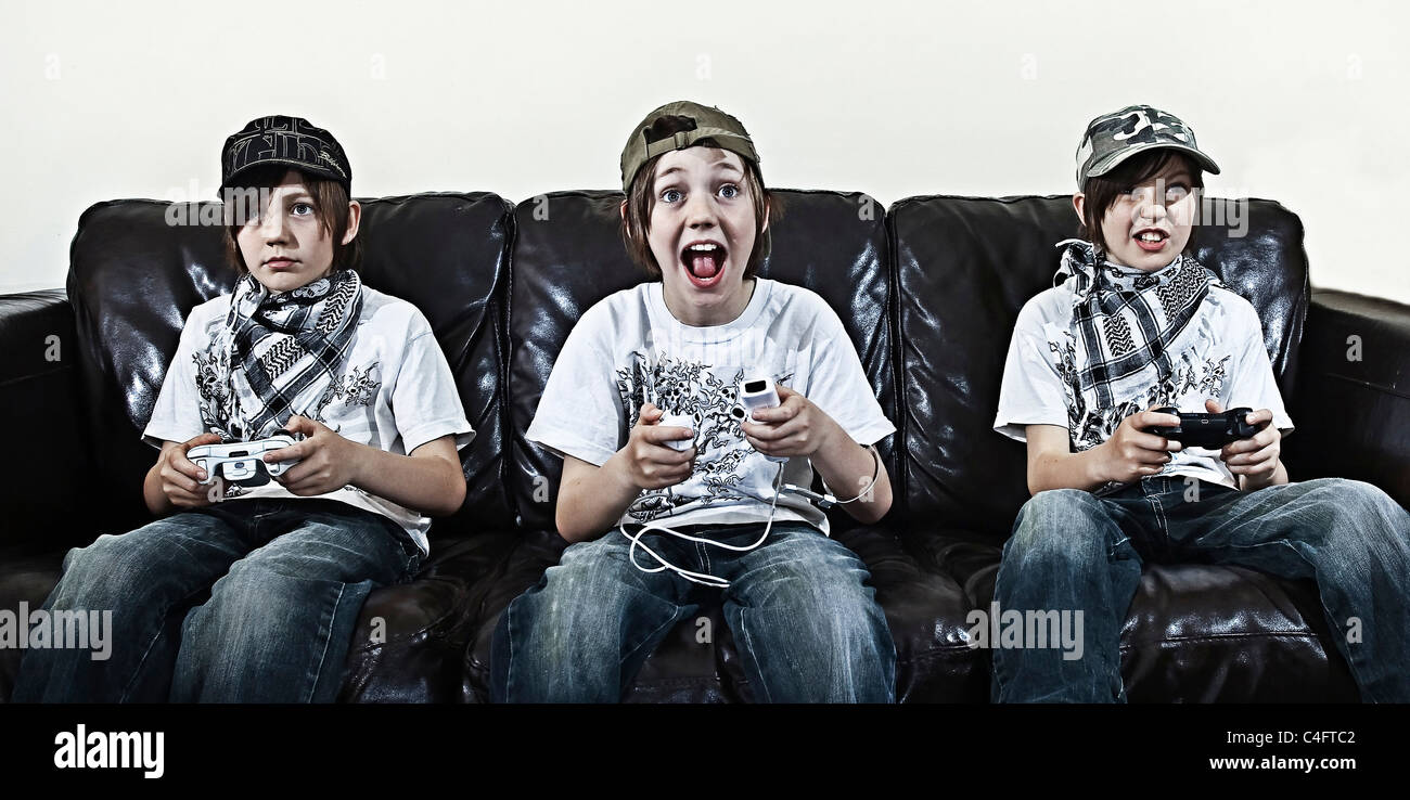 Teenager Child playing Wii Xbox 360 and PS3 / PS4 Stock Photo - Alamy