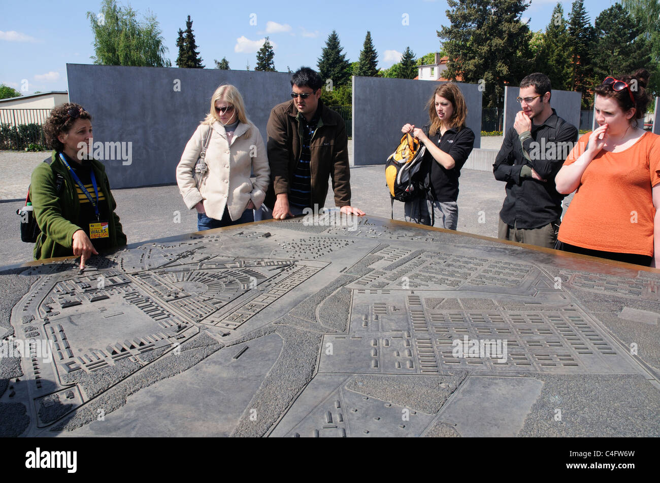 A guide and tourists and the scale model of Sachsenhausen concentration ...
