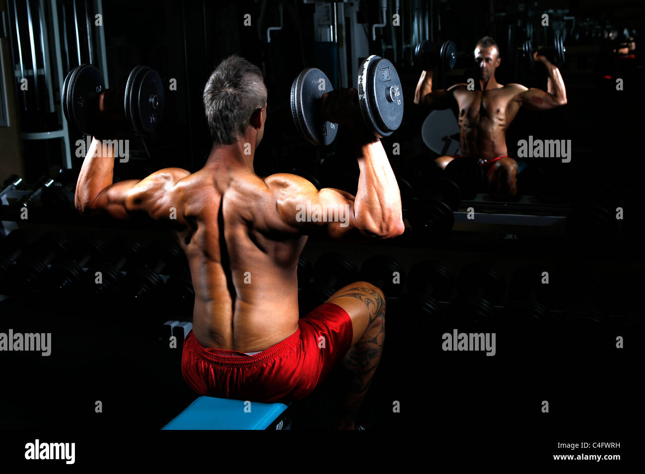 fit male working out in a gym shirtless Stock Photo - Alamy