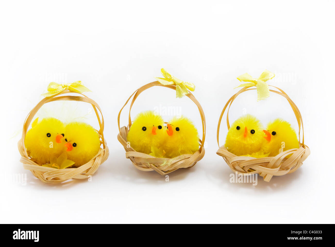 three baskets of easter chicks on a white background Stock Photo - Alamy