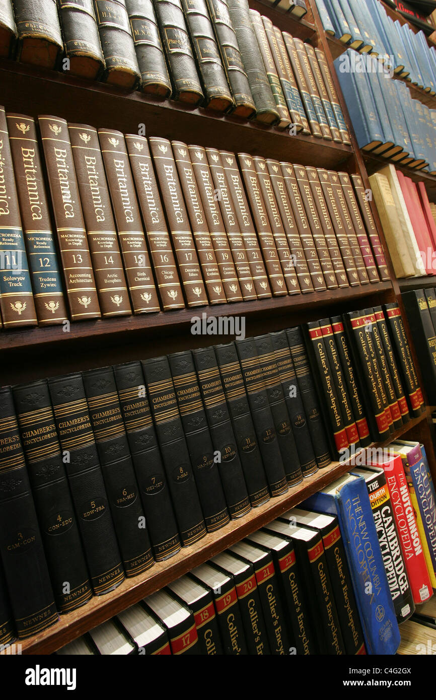 Books on shelves in a library Stock Photo - Alamy